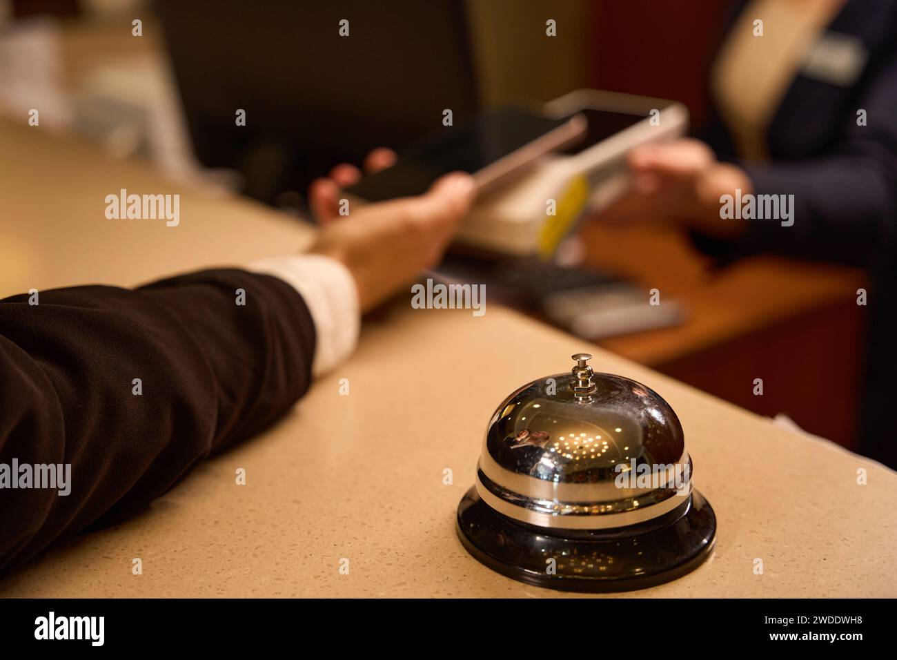 Close up photo of reception bell on desk Stock Photo - Alamy