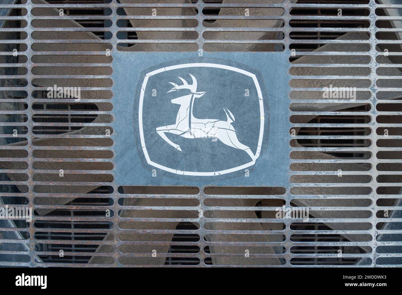 Closeup of used and dirty front grille and fan on John Deere truck ...