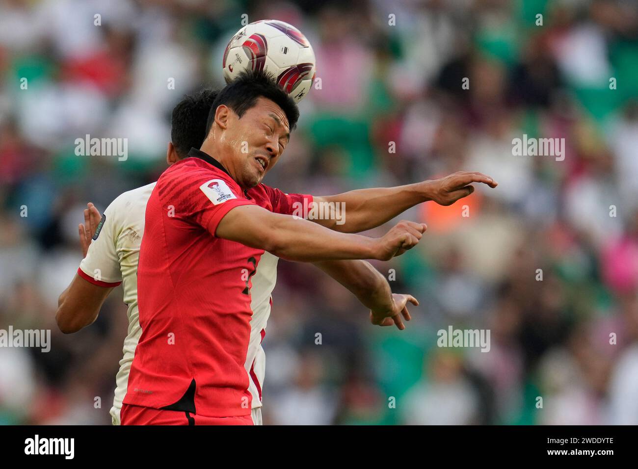 South Korea's Lee Ki-je, foreground, and Jordan's Mousa Altamari jump ...