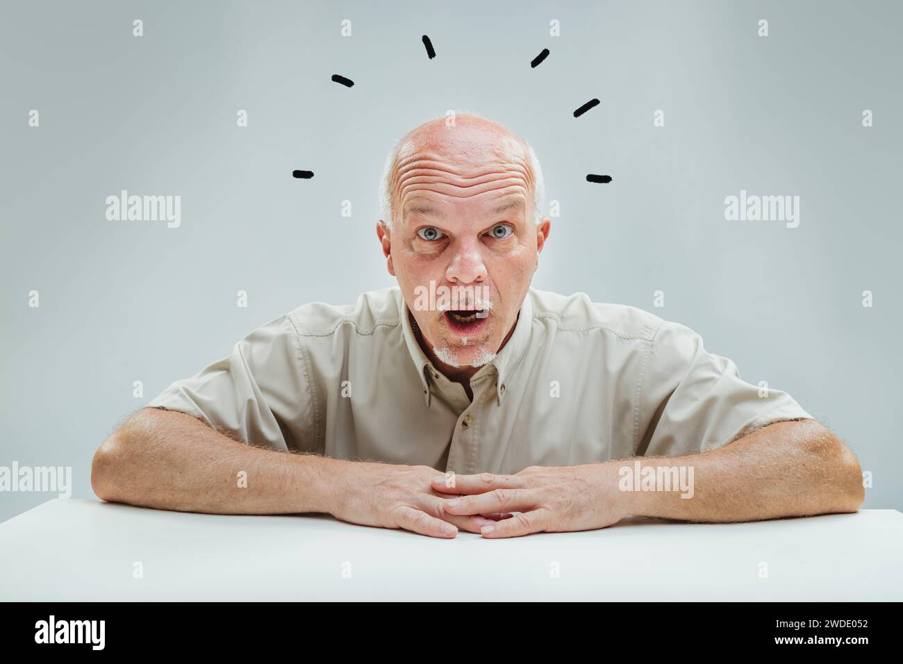 Surprised elder experiences a sudden epiphany, with symbolic lightbulb ...