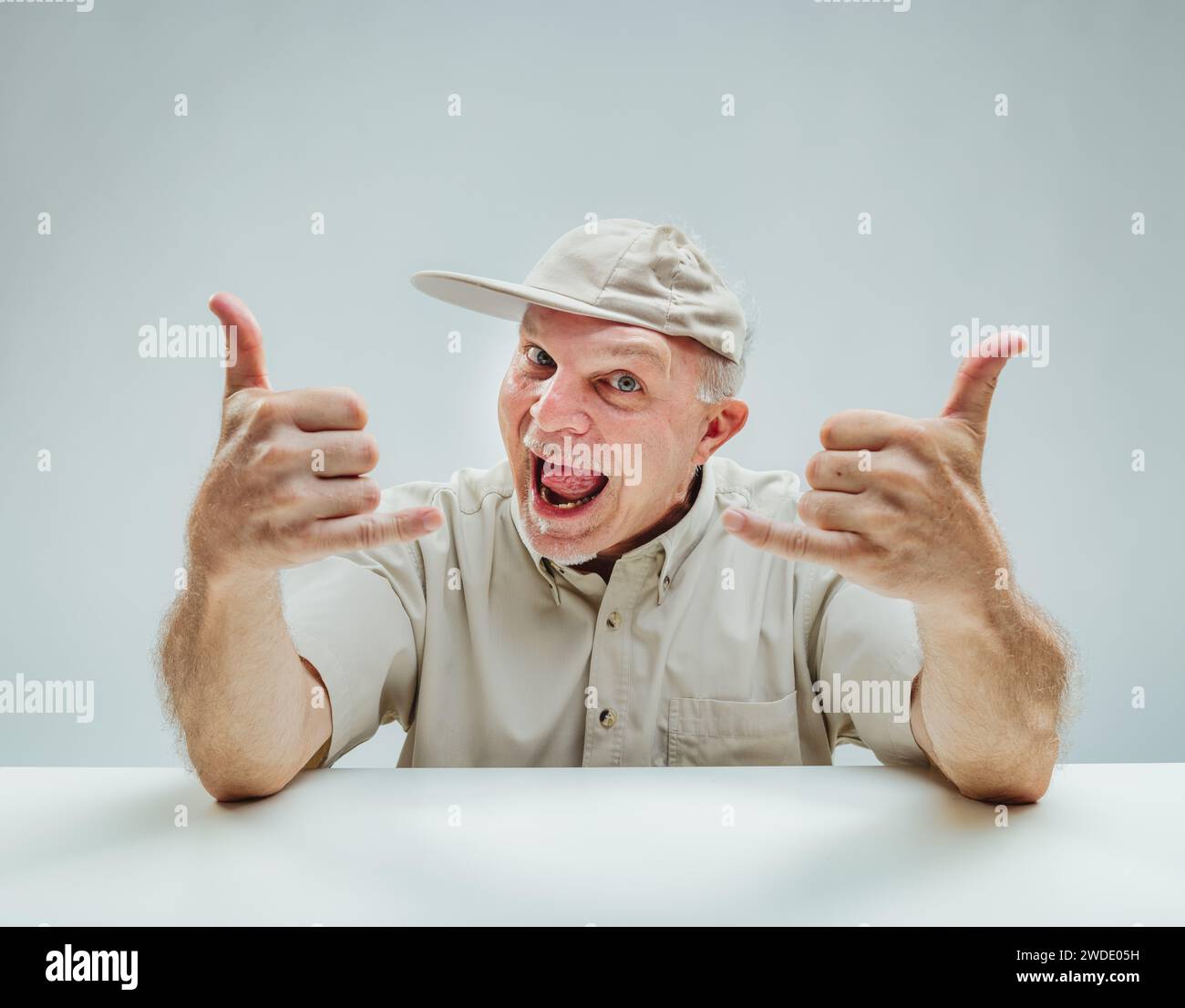 Joyful expression and thumbs up show man's cheerful agreement and ...