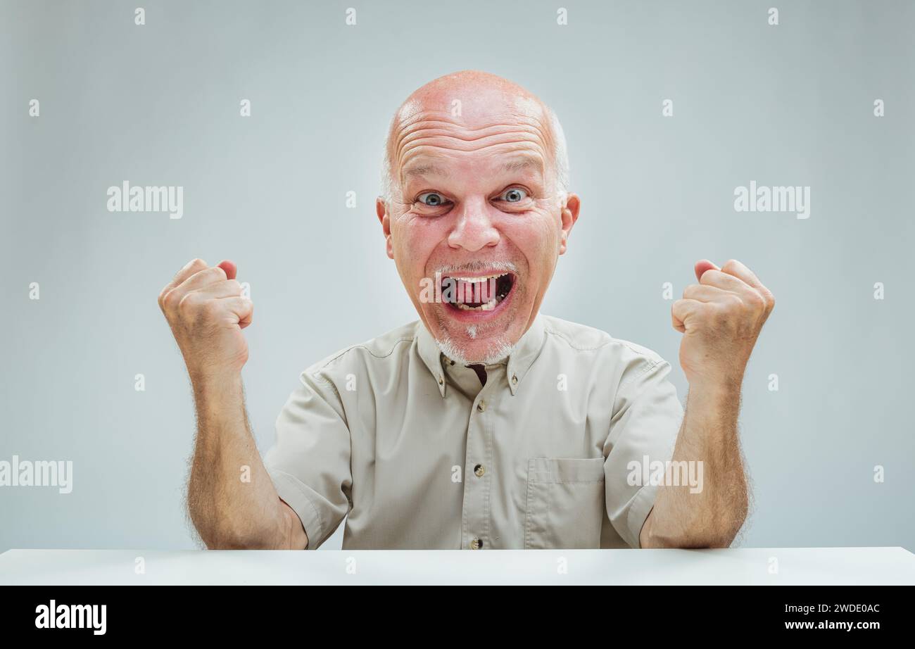 With fists clenched, man's exaggerated victory cheer captures the ...