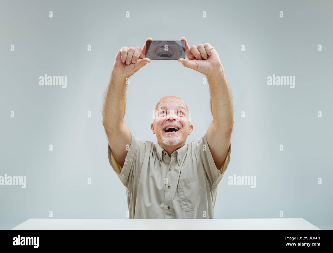 Cheerful expression mirrors hi-res stock photography and images - Alamy