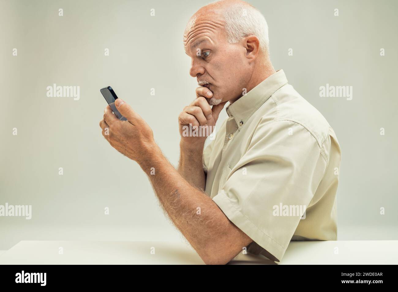 Intense concentration shows as the man tries to understand intricate ...