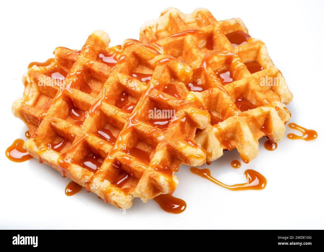 Belgian waffle with caramel topping isolated on white background Stock ...