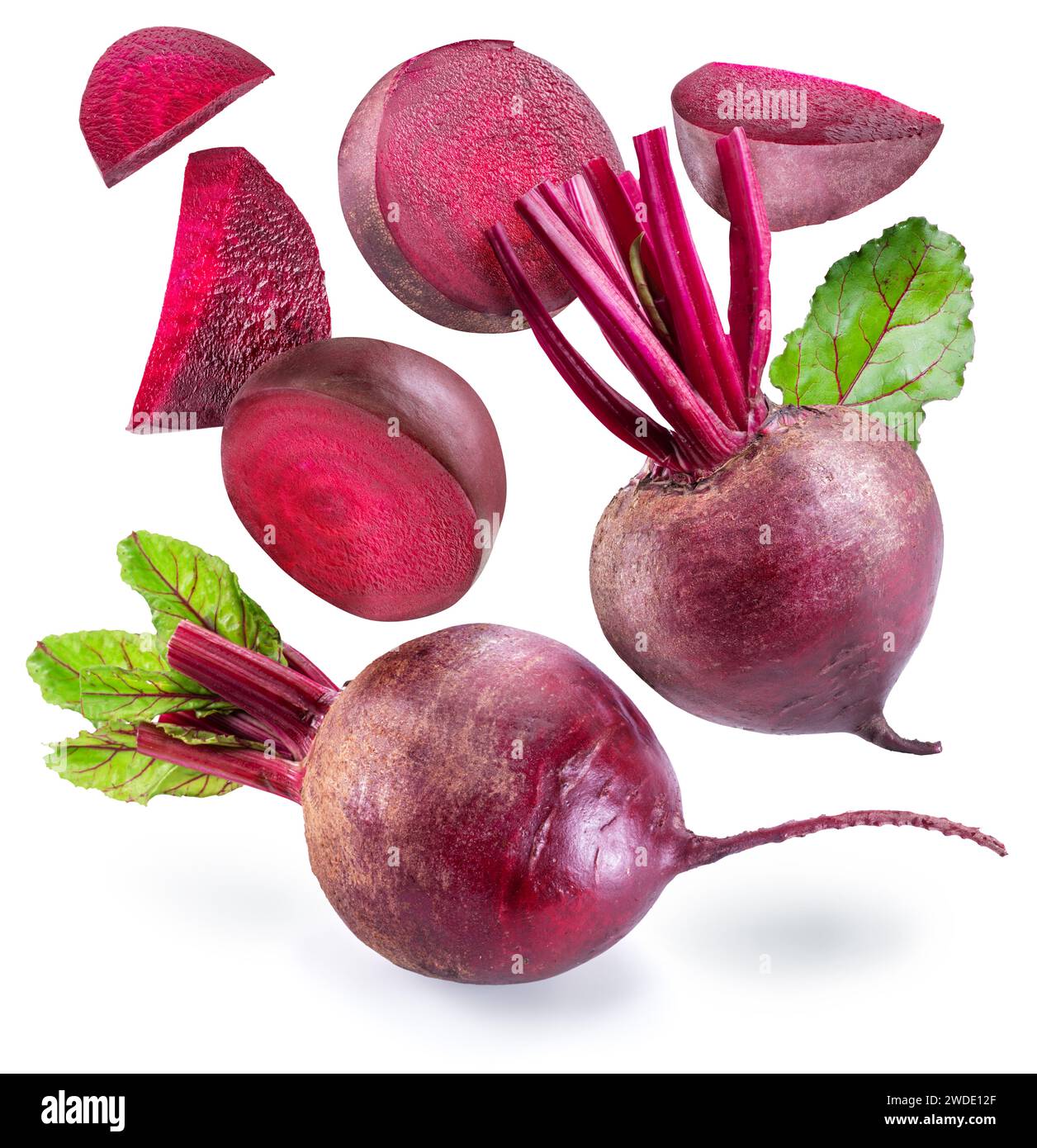 Beetroot and slices of beetroot or taproot levitating in air. File ...