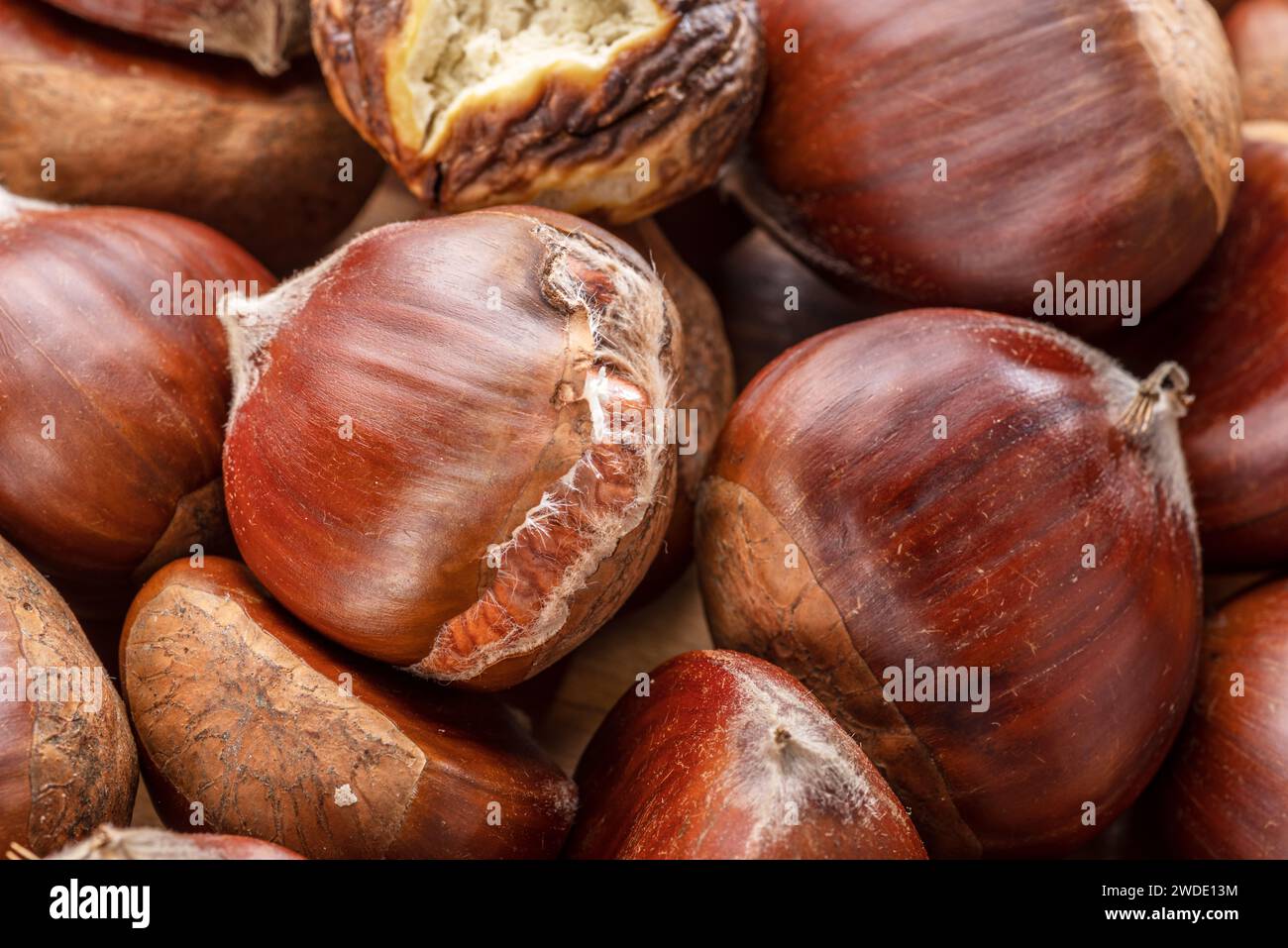 Edible sweet chestnuts with roasted chestnut. Great food background for ...