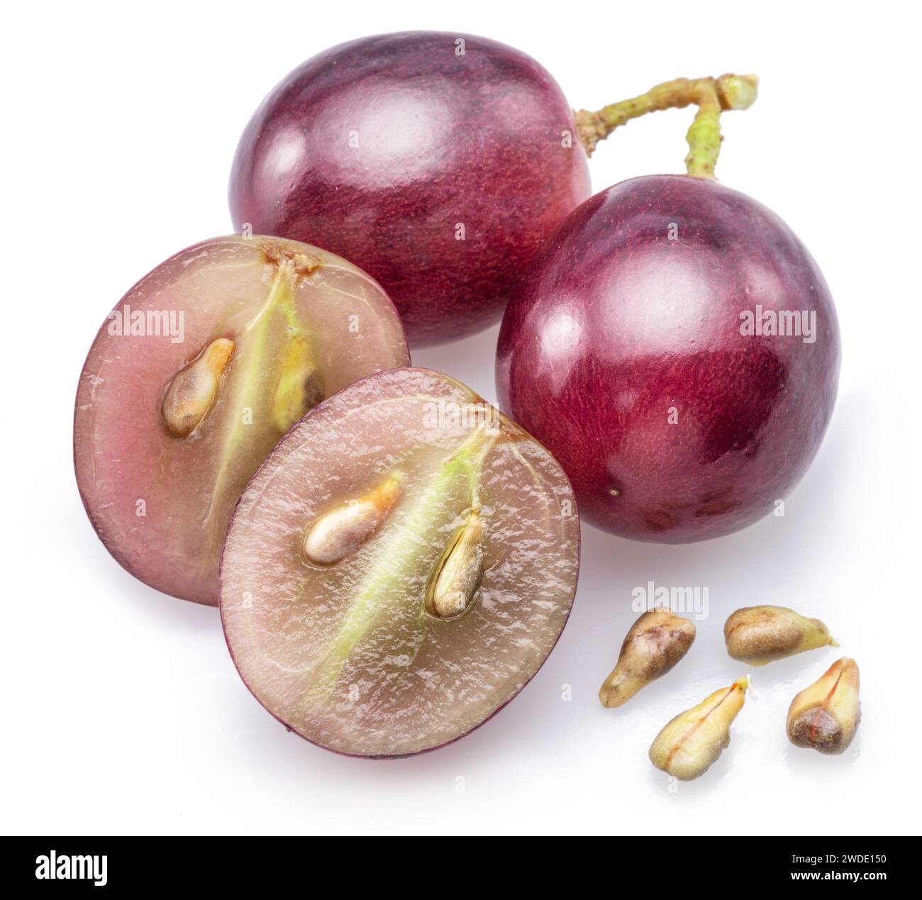 Red table grape berries and grape seeds isolated on white background ...