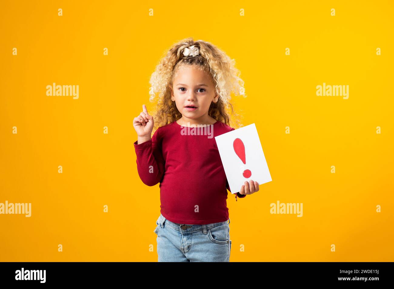 Enchanting Exploration. A Portrait of a Thoughtful child Girl Holding ...