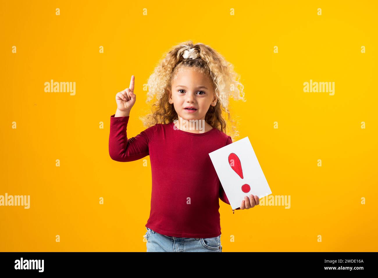 Enchanting Exploration. A Portrait of a Thoughtful child Girl Holding ...