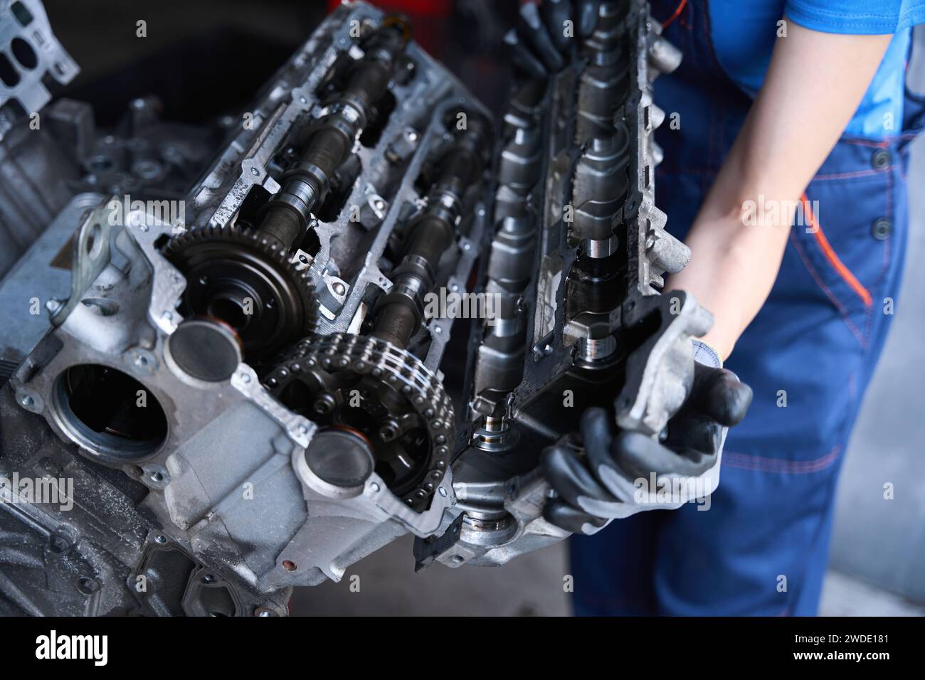 Professional repair of a car engine in car repair shop Stock Photo - Alamy