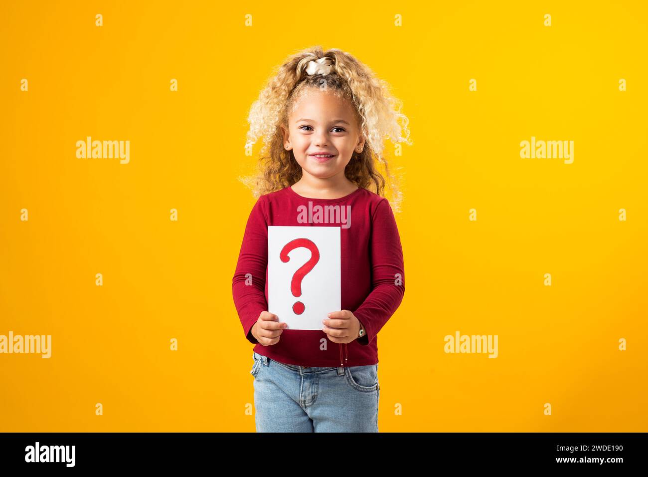Enchanting Exploration. A Portrait of a Thoughtful child Girl Holding ...