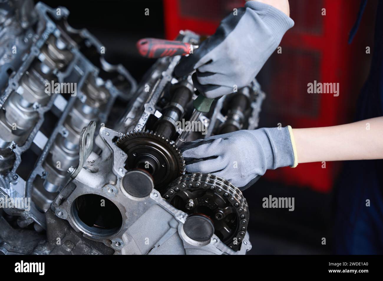 Master uses special tools to repair engine of modern car Stock Photo ...