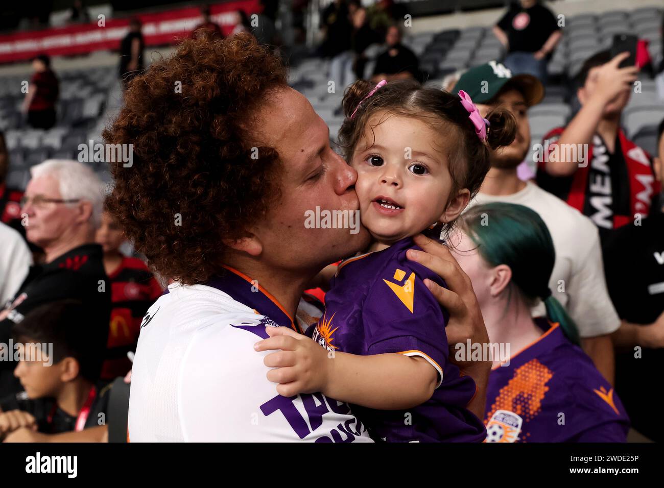 SYDNEY, AUSTRALIA - JANUARY 20: Mustafa Amini of Perth Glory kisses his ...