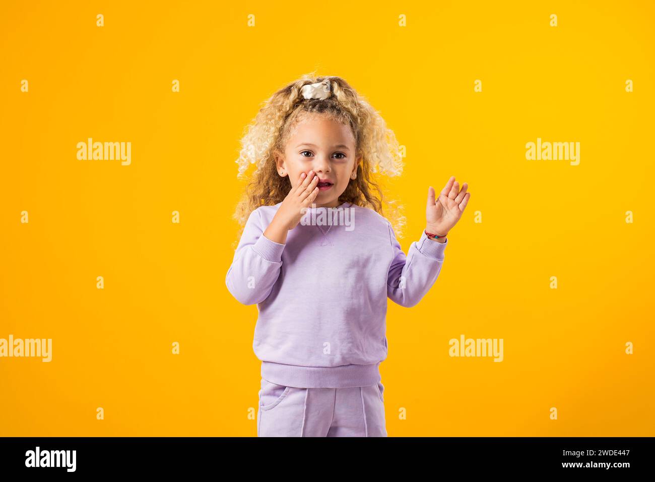 Portrait of surprised child girl, eyes wide open, expressing genuine ...