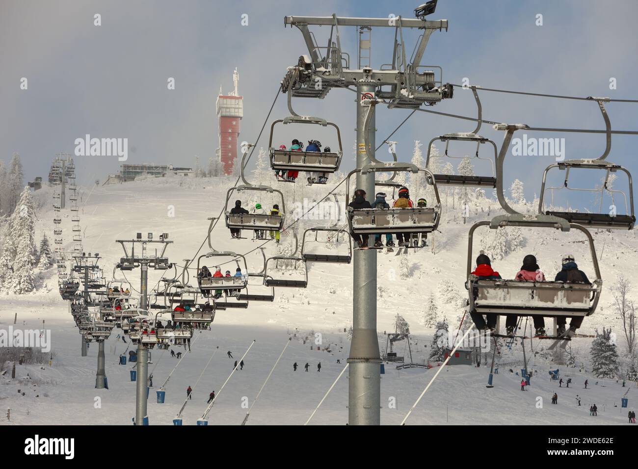 Braunlage, Germany. 20th Jan, 2024. Skiers take the ski lift up to the ...