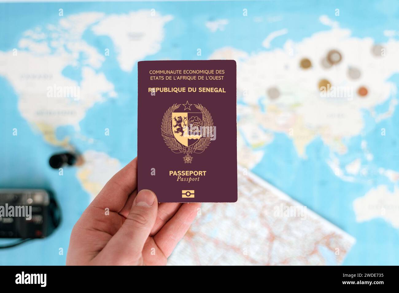Senegal passport in hand Stock Photo - Alamy