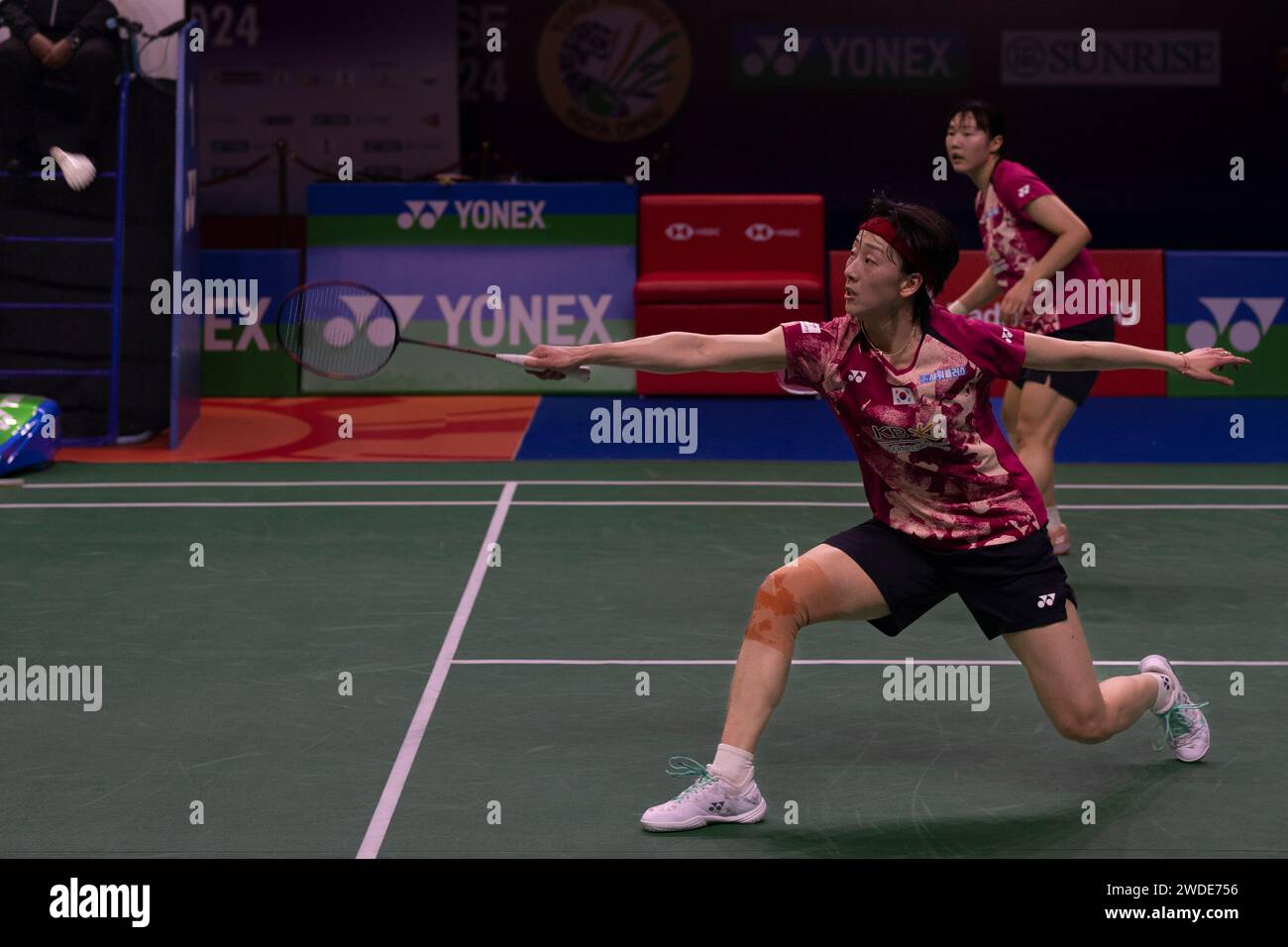 South Korea's Lee So Hee, front, returns a shot as her partner Baek Ha Na, looks on, as they ...