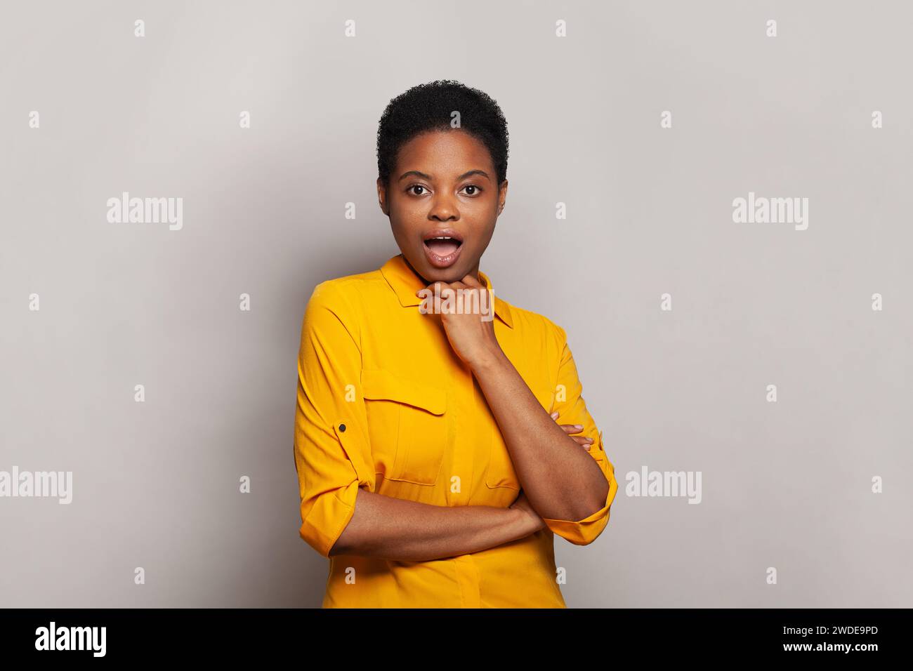 Pretty shocked woman. Young emotional model, studio portrait. Surprise ...