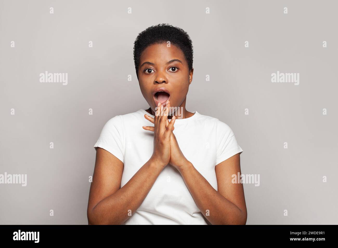 Perfect shocked woman. Young emotional model, studio portrait. Surprise ...
