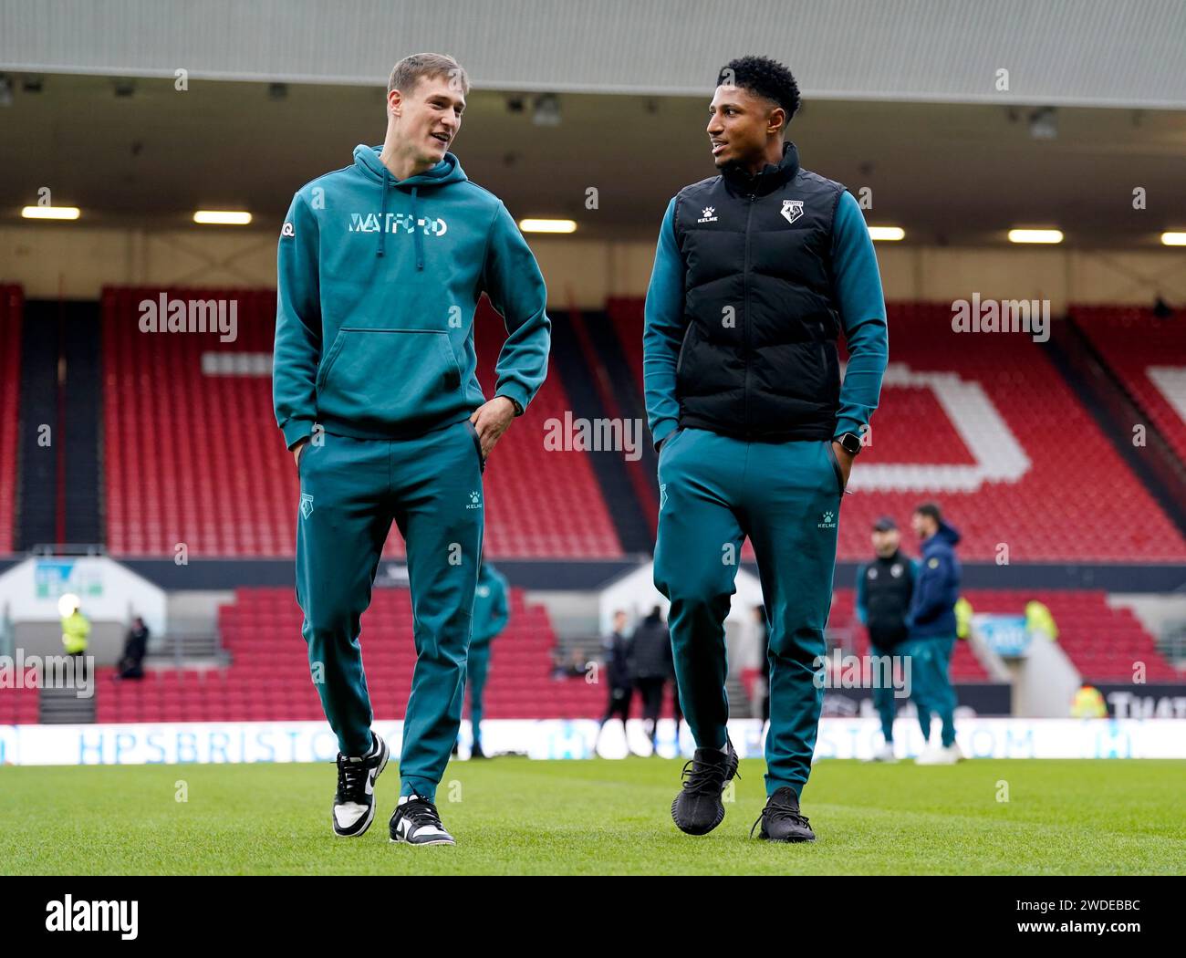 Watford's Mileta Rajovic (left) and Myles Roberts inspect the pitch ...