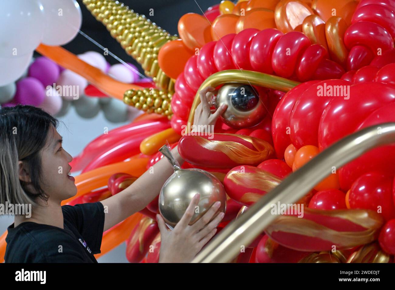 Kuala Lumpur, Malaysia. 18th Jan, 2024. Syndy Tan uses balloons to ...