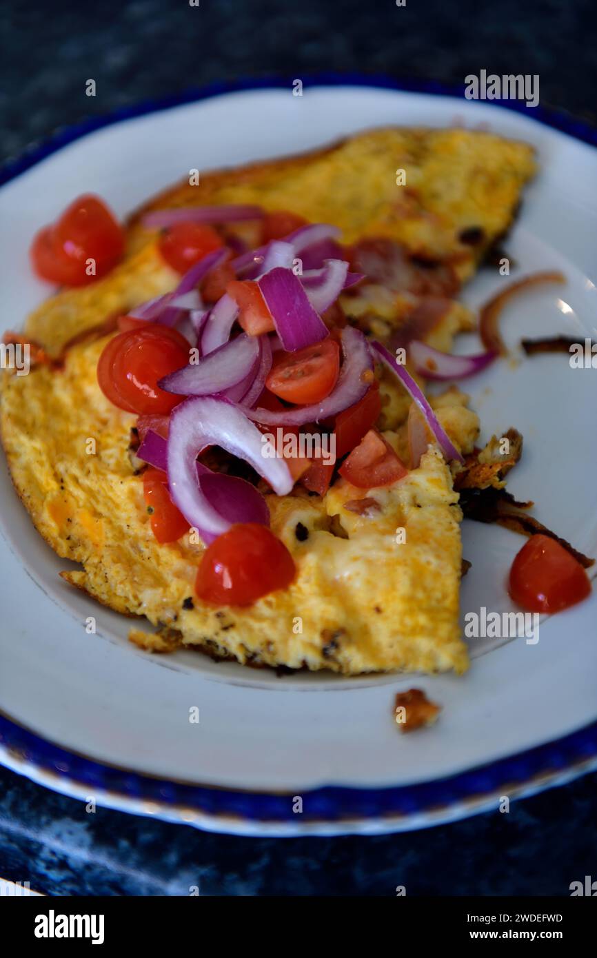 Cheese Omelette with mixed veg red onions Stock Photo - Alamy