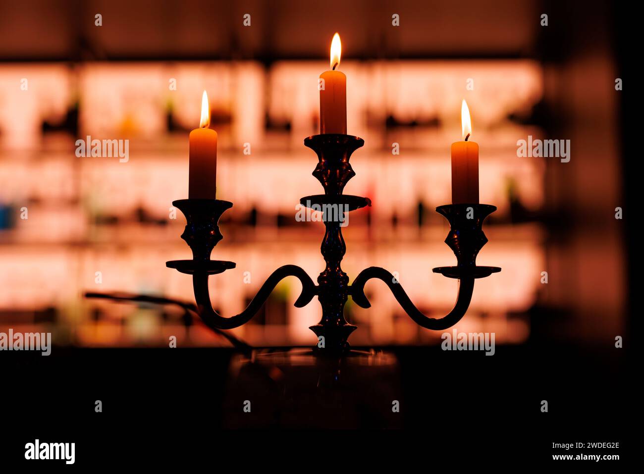 Elegant candlelight from a classic candelabra illuminates a room Stock ...