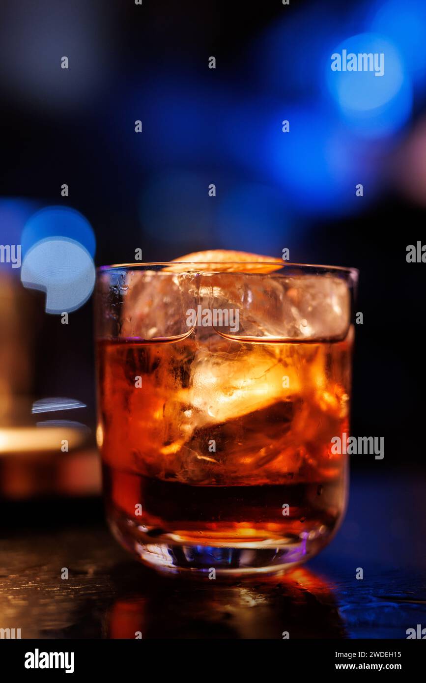 A glass of whiskey on the bar counter Stock Photo - Alamy