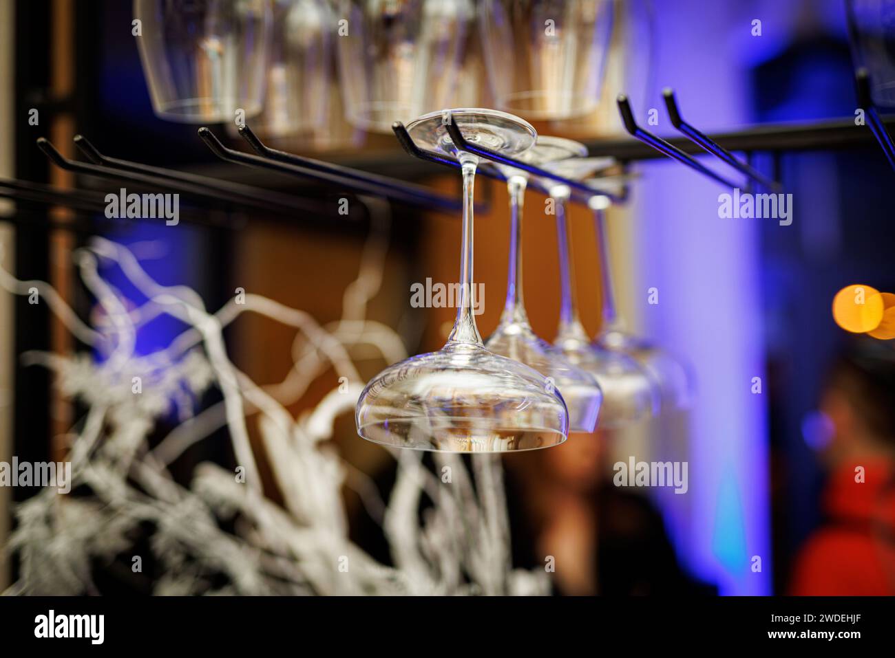 Empty glass clean upside-down stemware in nightclub or a restaurant ...