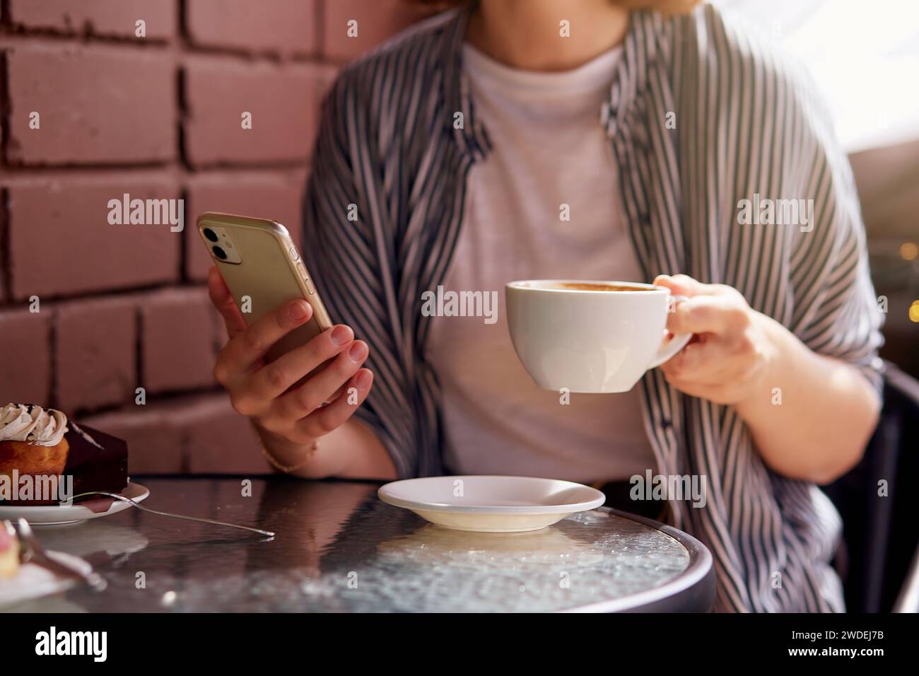 Woman during a coffee break savoring a moment of her busy day. Urban ...