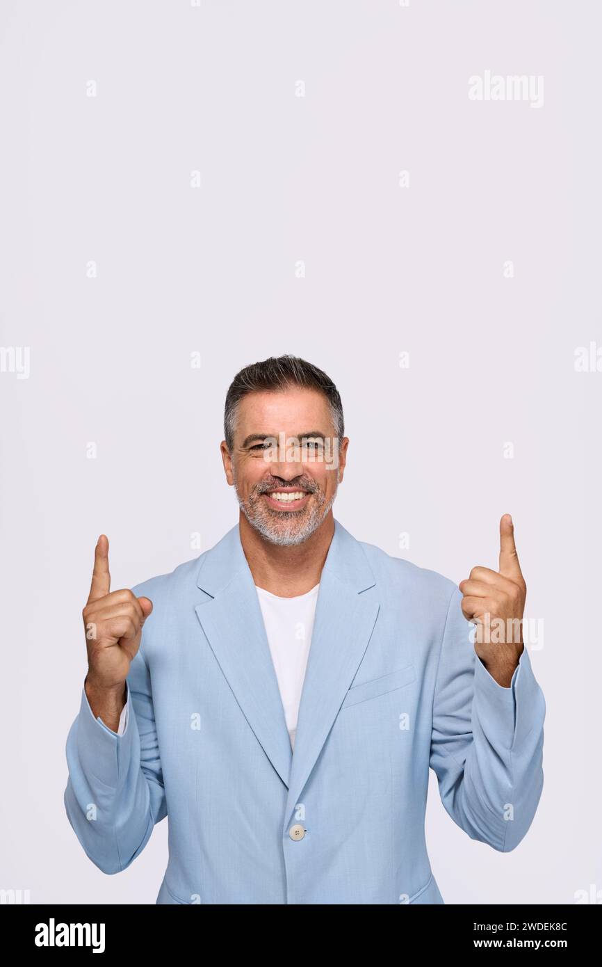 Happy middle aged business man pointing up advertising isolated on ...
