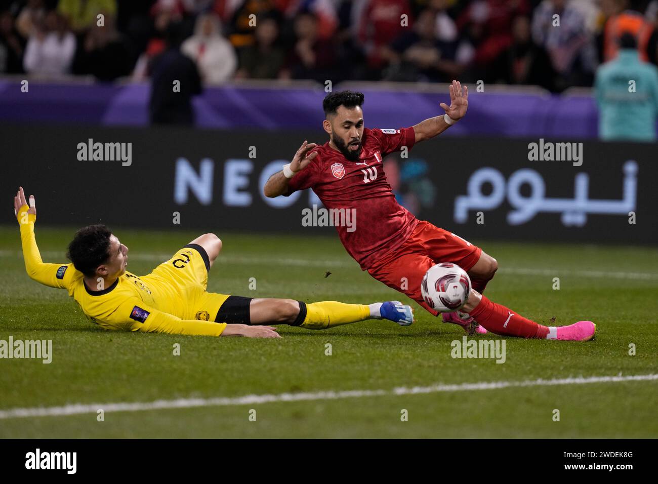 Malaysia's Dion Cools, left, prevents Bahrain's Komail Alaswad to score ...