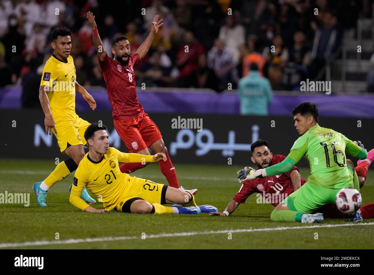 Bahrain's Mohamed Marhoon, second left, reacts as his teammate Komail ...