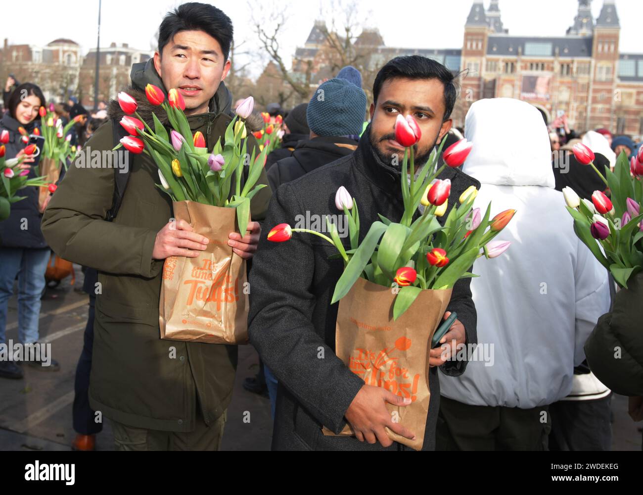 Tourists hold tulip bouquet attend National Tulip Day at the Museum ...