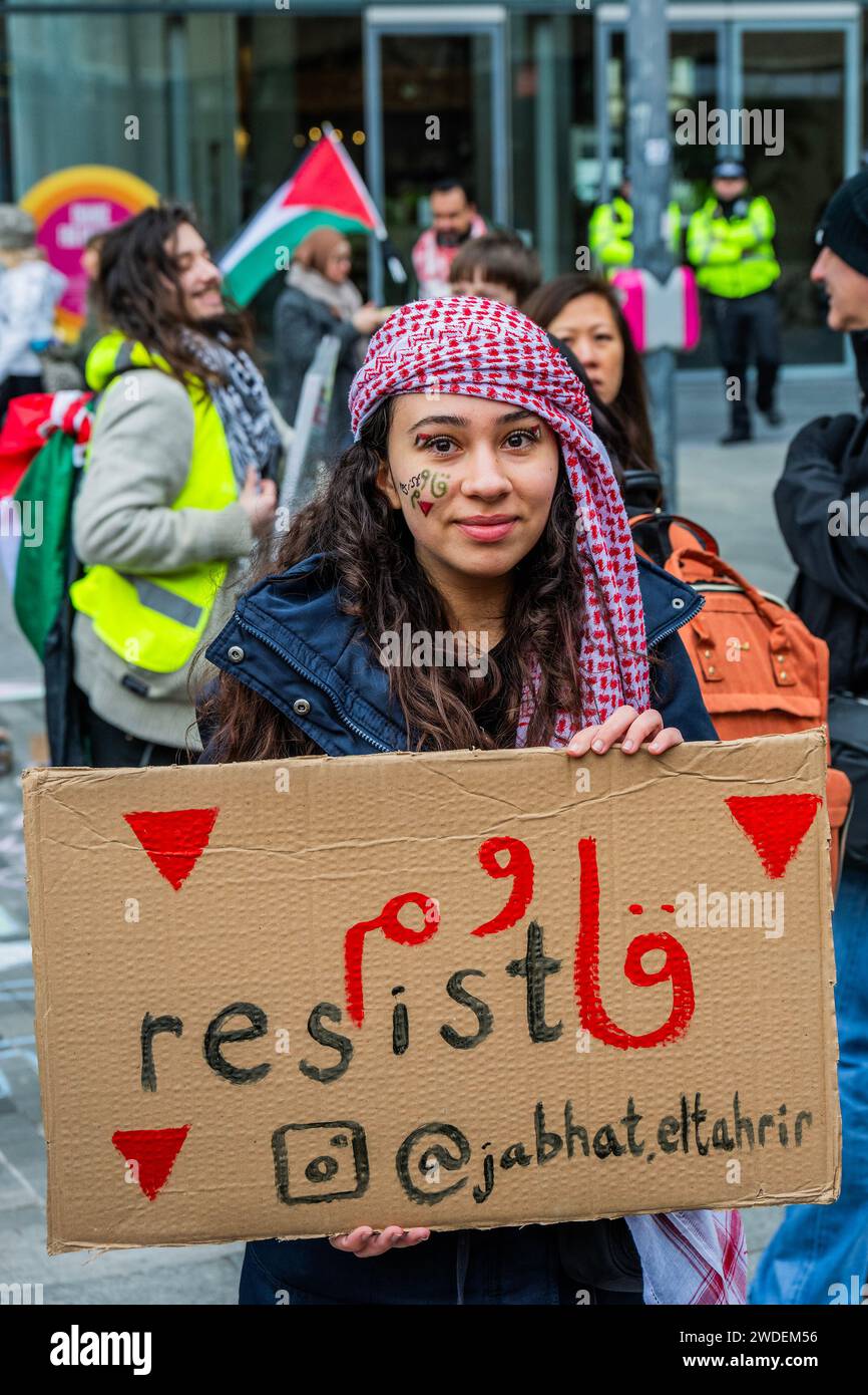 London, UK. 20th Jan, 2024. Face painted 'Resist' in arabic and english ...