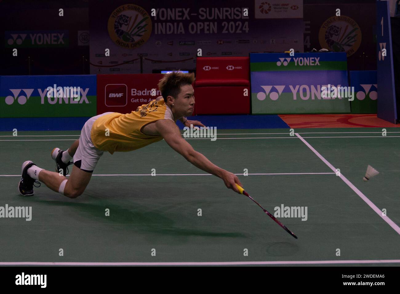 Singapore's Lee Cheuk Yiu dives to return a shot as he competes against ...