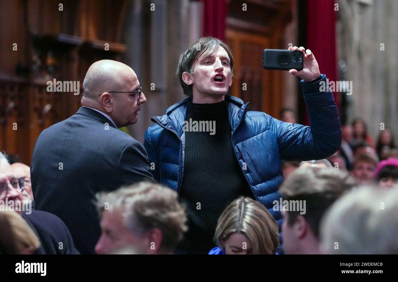 A protester is removed from the room after interrupting shadow foreign ...