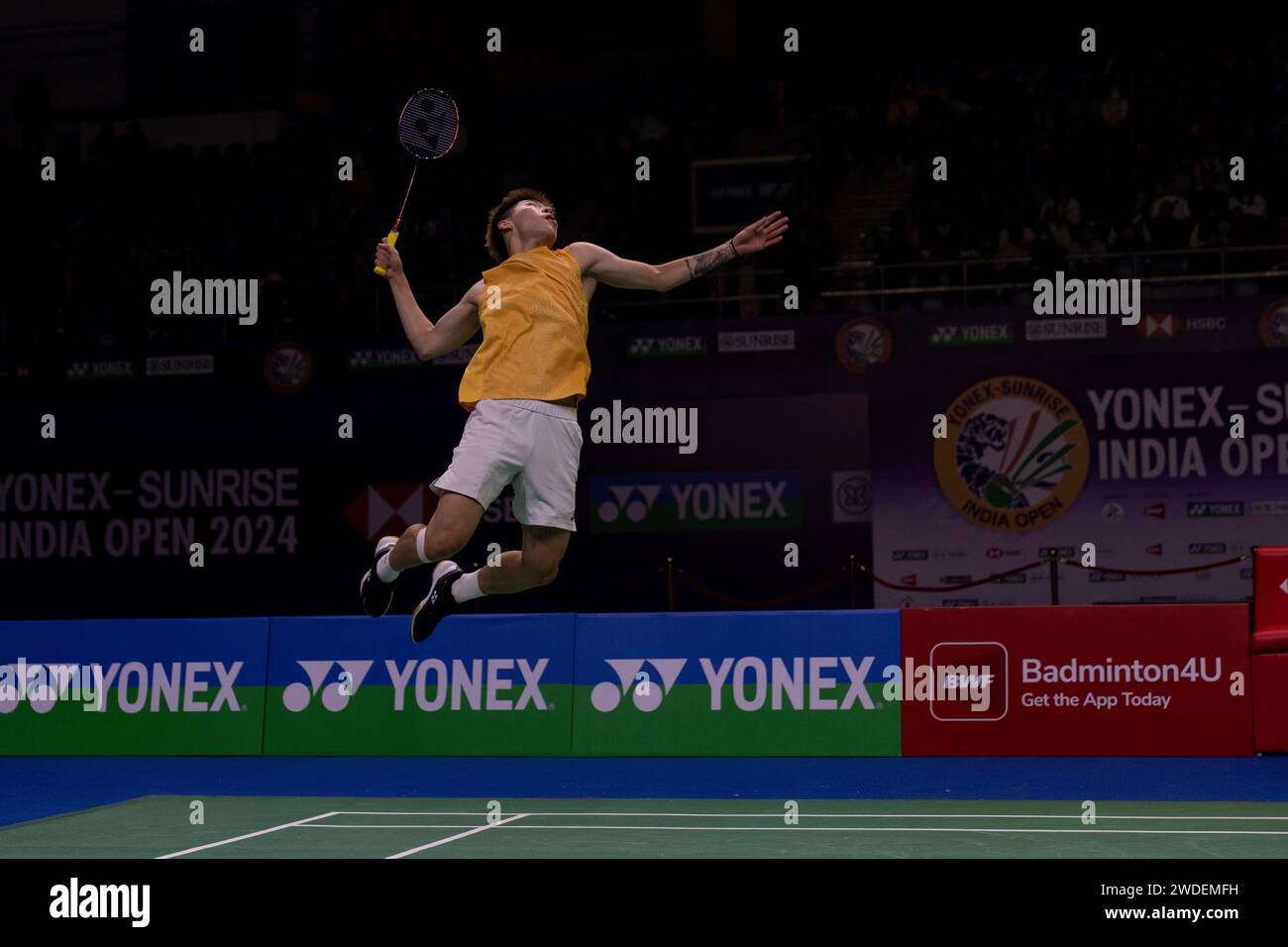 Singapore's Lee Cheuk Yiu leaps in air to return a shot as he competes ...