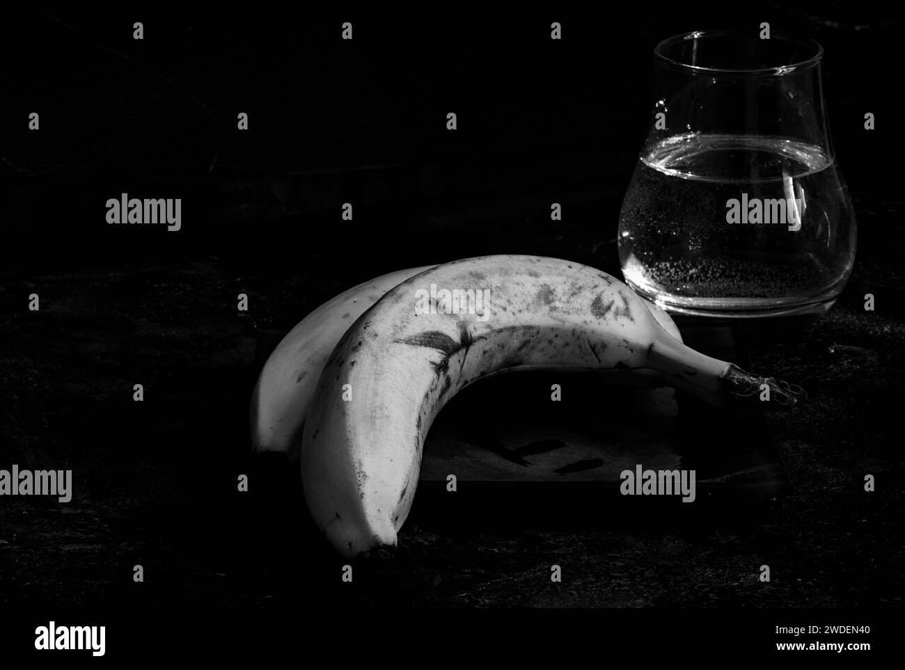 Bananas and glass of water (black and white Stock Photo - Alamy