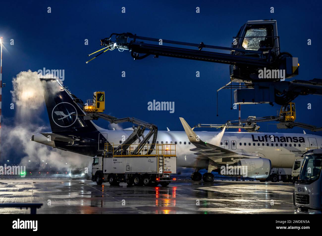 Winter at Frankfurt Main Airport, FRA, Lufthansa aircraft being de-iced ...