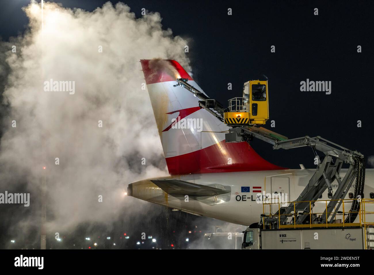 Winter at Frankfurt Main Airport, FRA, Austrian aircraft being de-iced ...