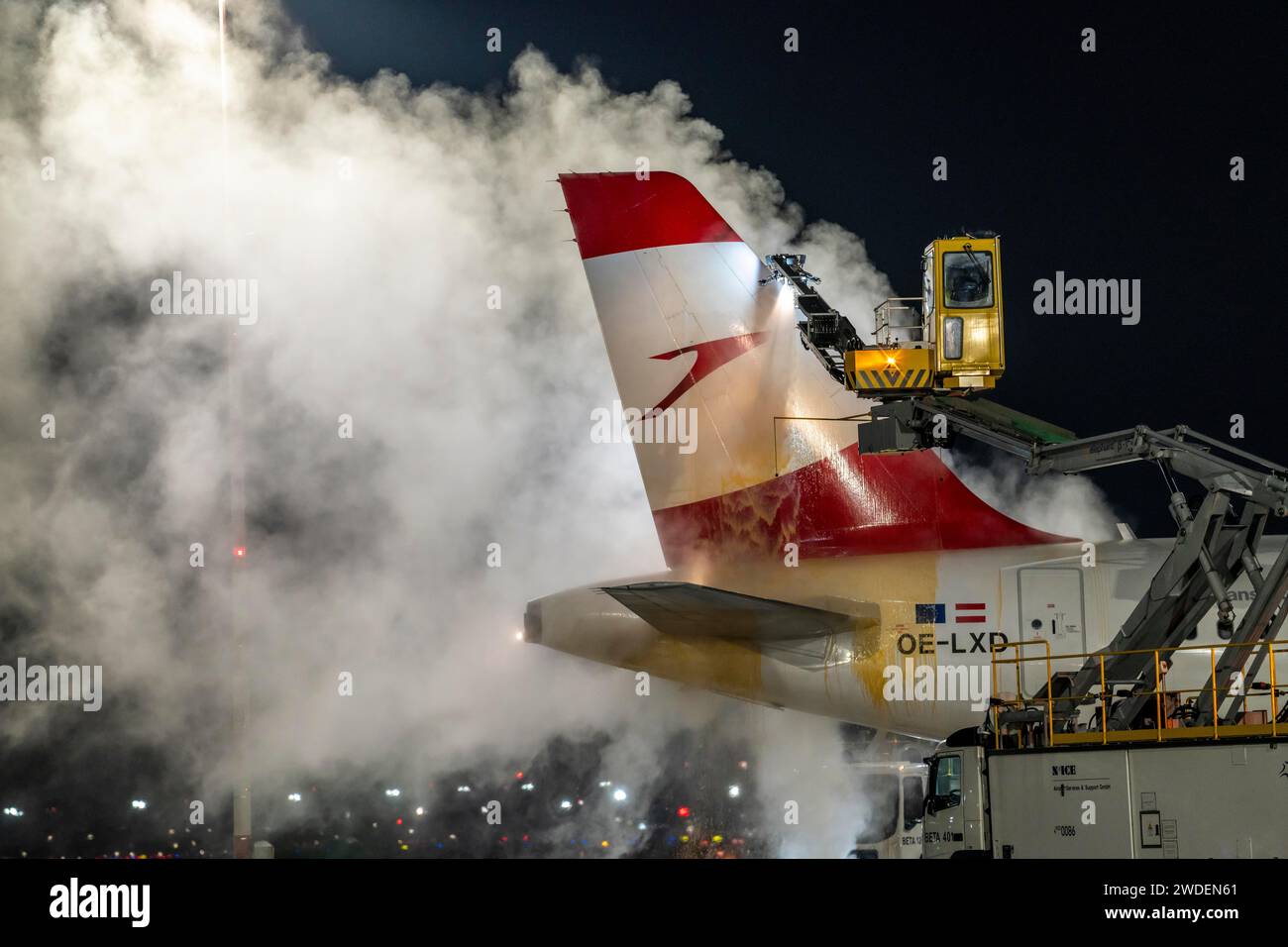 Winter at Frankfurt Main Airport, FRA, Austrian aircraft being de-iced ...