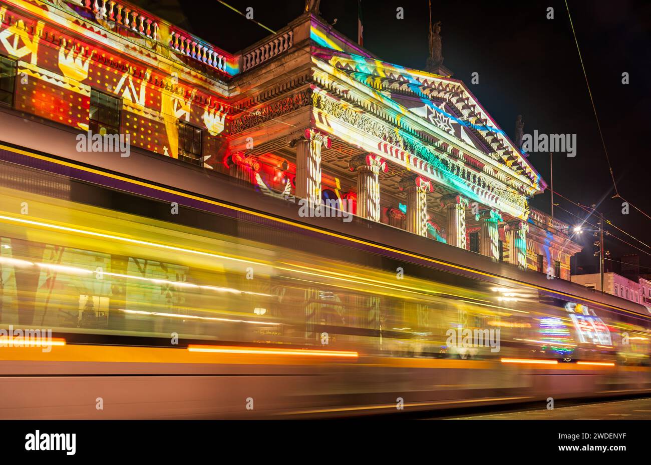 Luas passing by the GPO lit up with the winter lights Stock Photo - Alamy