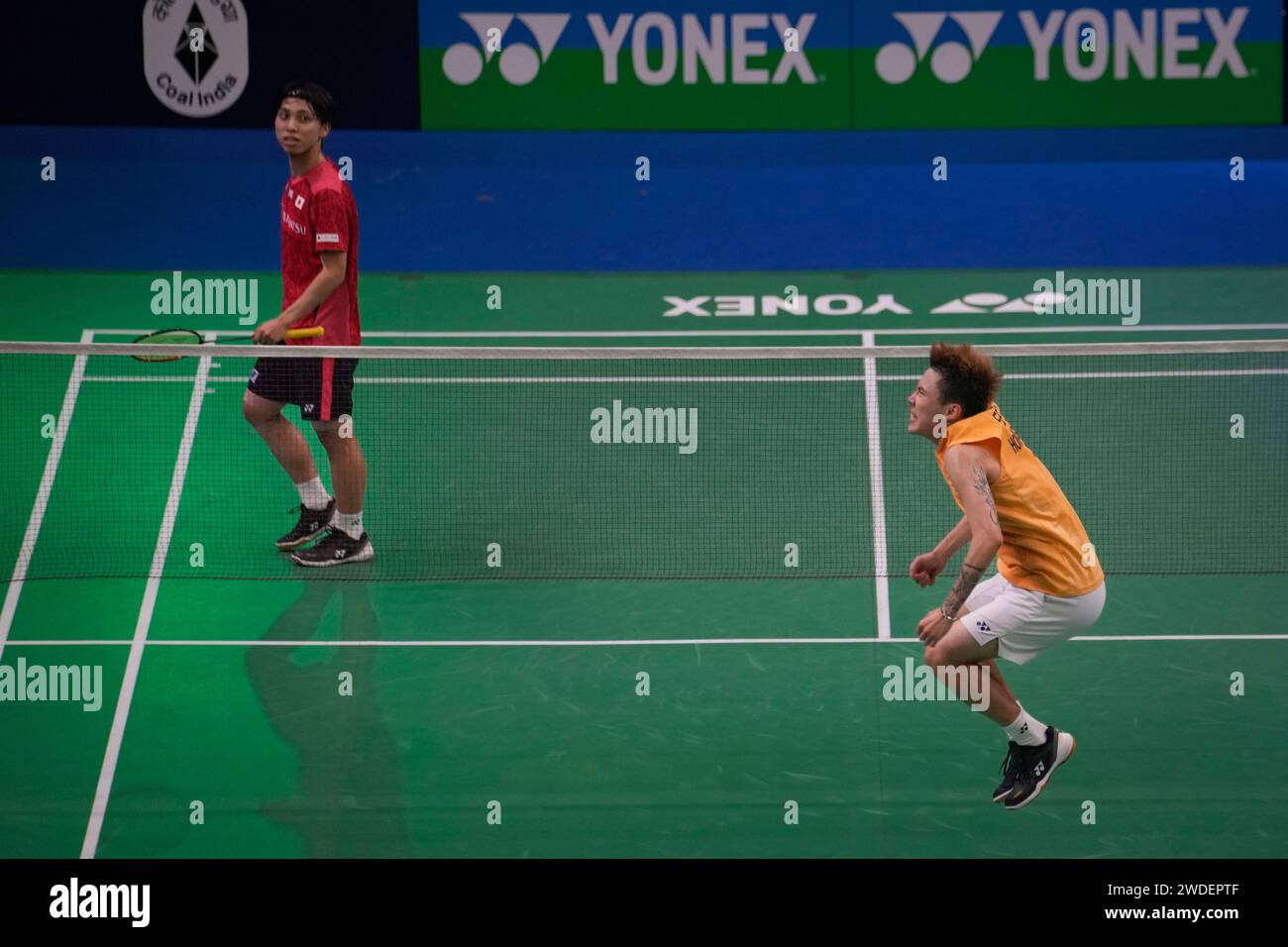 Singapore's Lee Cheuk Yiu, foreground in yellow, jumps in air as he ...