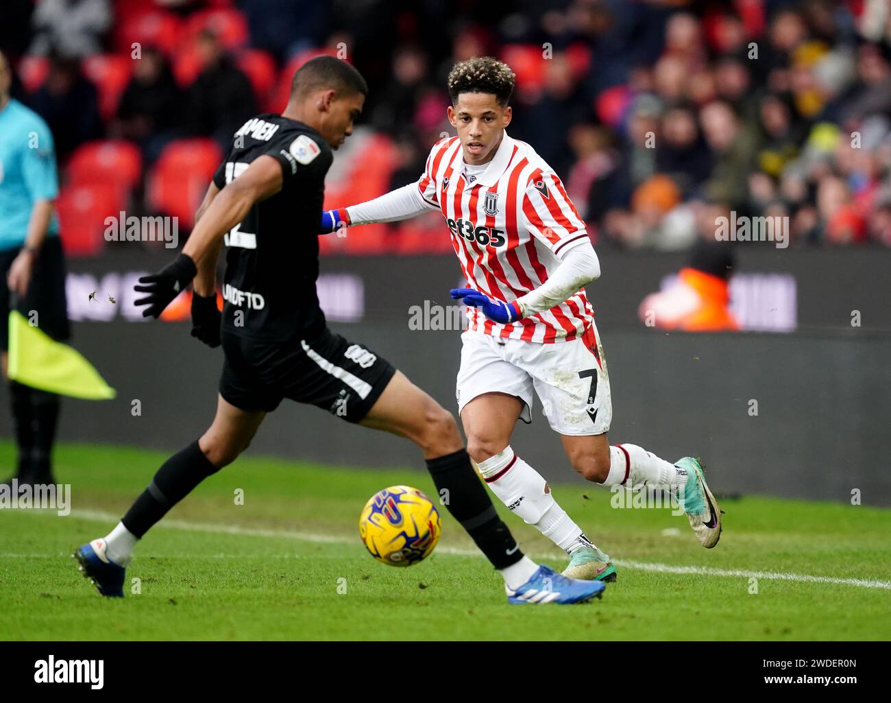Bristol City's Jason Knight (left) and Stoke City's Andre Vidigal ...
