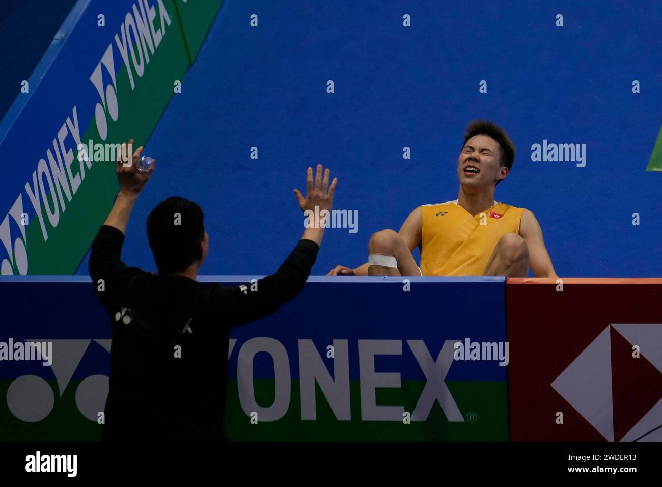 Singapore's Lee Cheuk Yiu, in yellow, celebrates after beating Japan's ...