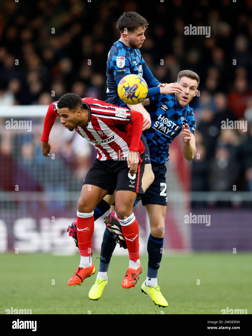 Lincoln City's Ethan Erhahon and Derby County's Max Bird battle for the ...