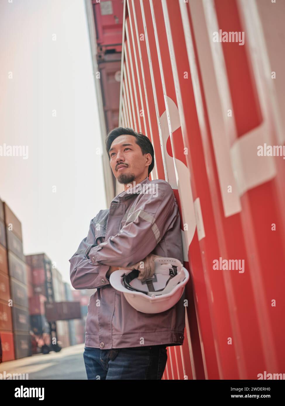 Worker near container in industry factory logistic shipping warehouse ...