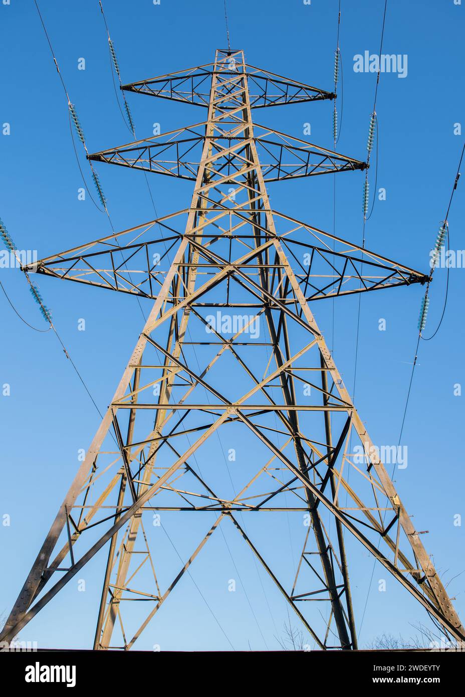 View looking up to electricity pylon of the national grid from a low ...